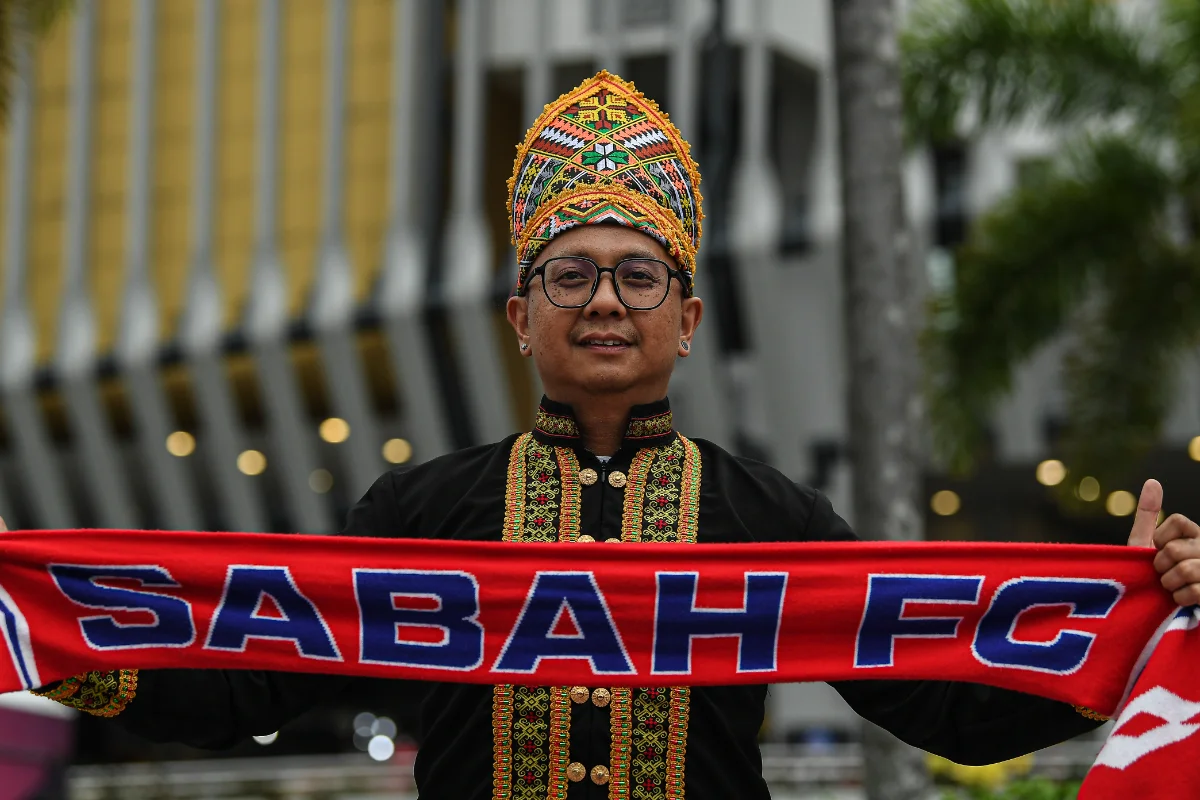 Sabah FC fan's traditional attire steals show at FA Cup final