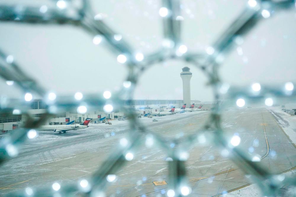 ‘Travel insanity’: US passengers stranded by winter storm
